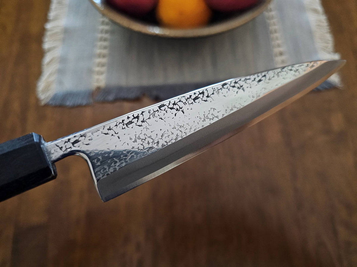 The beautiful polished blade is a different look from basic petty blad ...